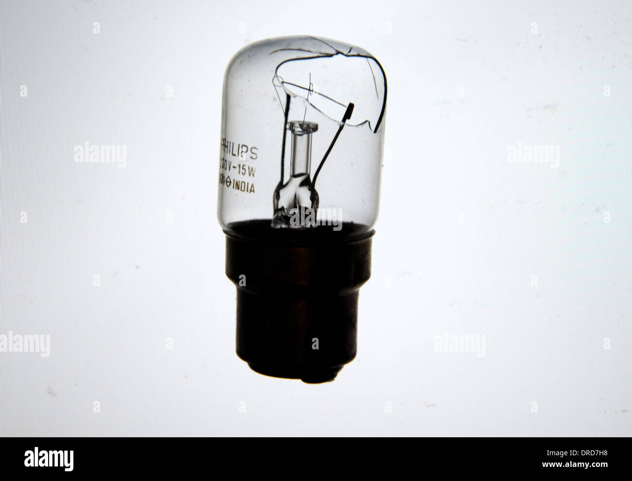 Isolated broken lightbulb on white background, exposed filament Stock ...