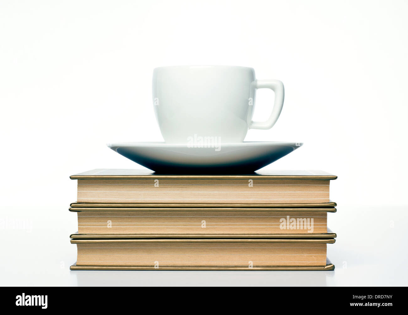 cup with books on white background Stock Photo - Alamy