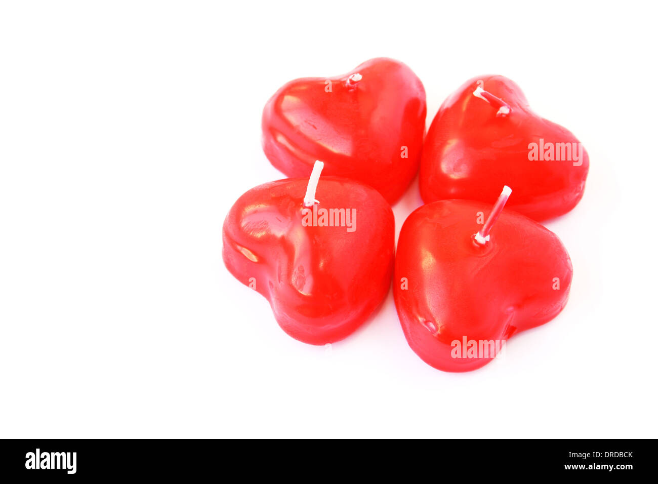 Heart shape red candles isolated on white background Stock Photo - Alamy