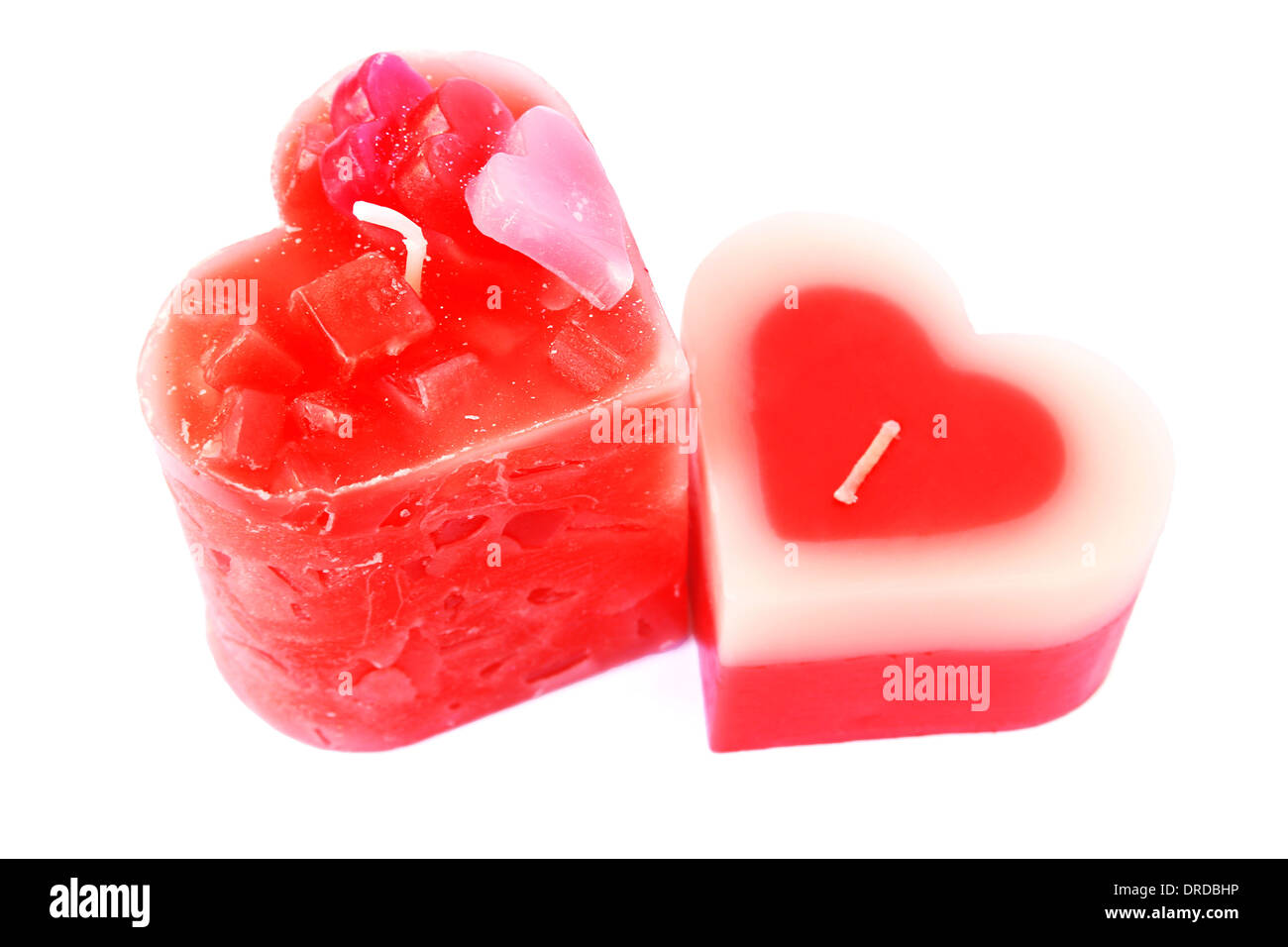 Heart shape red candles isolated on white background Stock Photo - Alamy