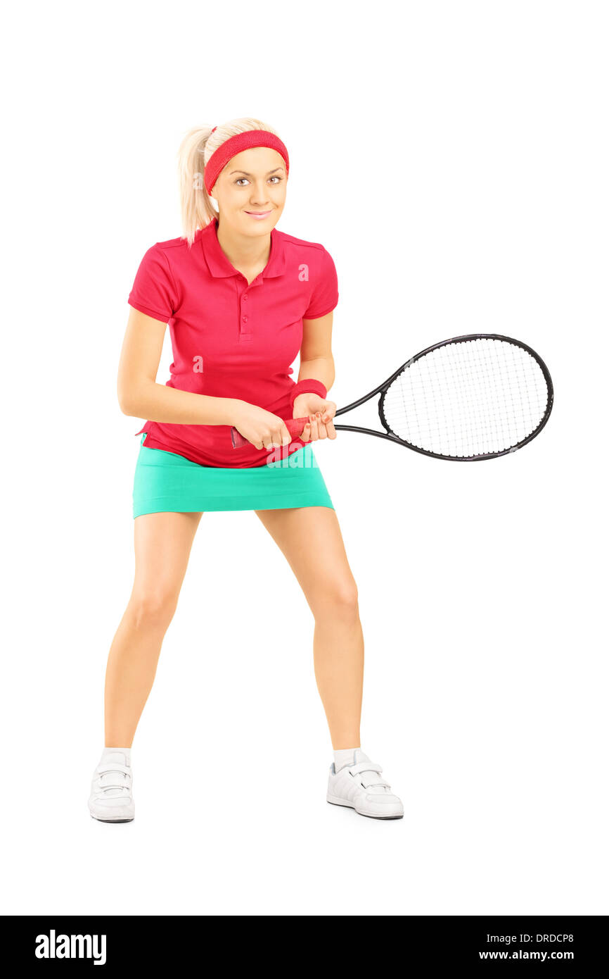 Full length portrait of young female tennis player holding a racket ...
