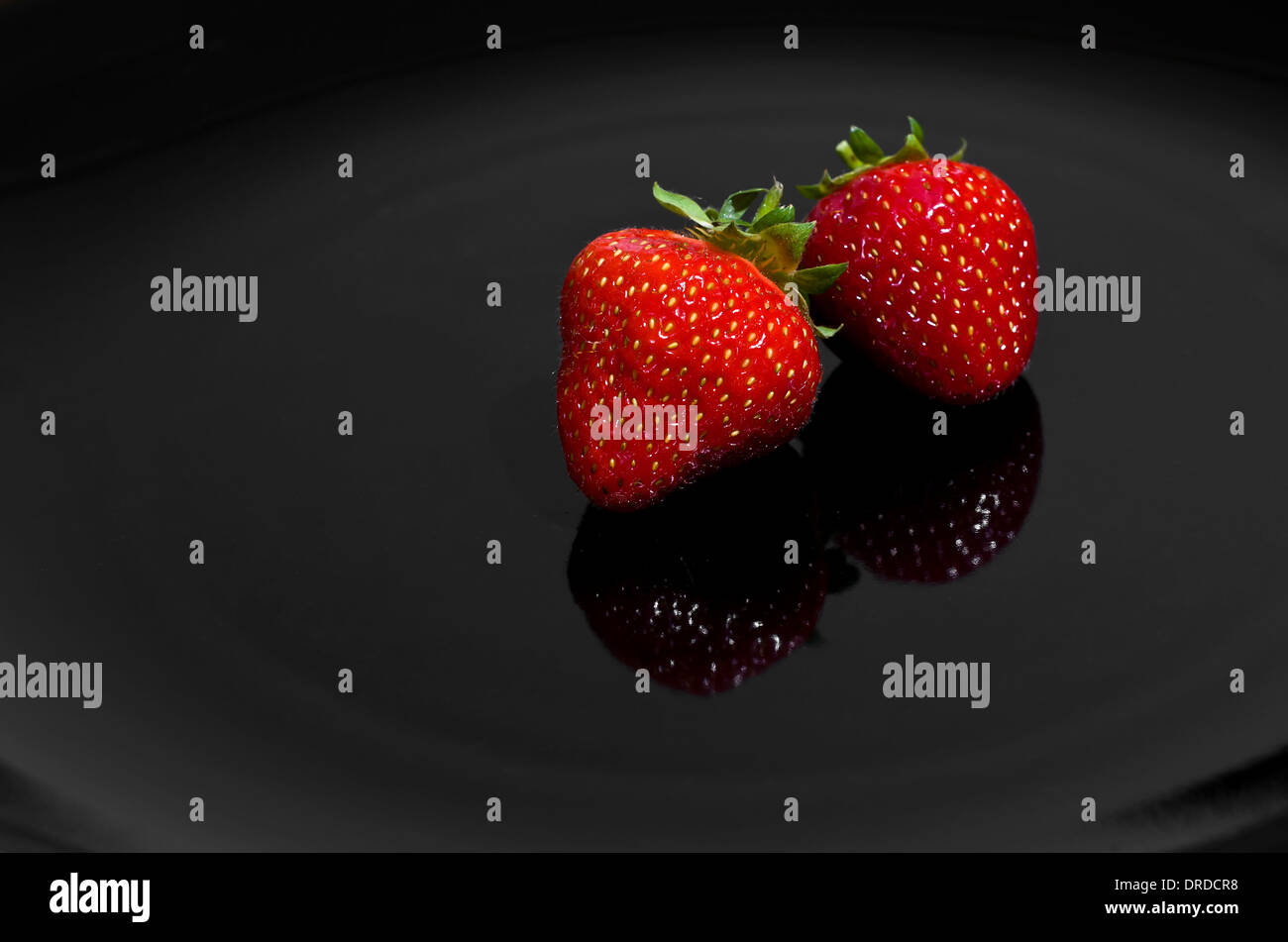 Two strawberries hi-res stock photography and images - Alamy