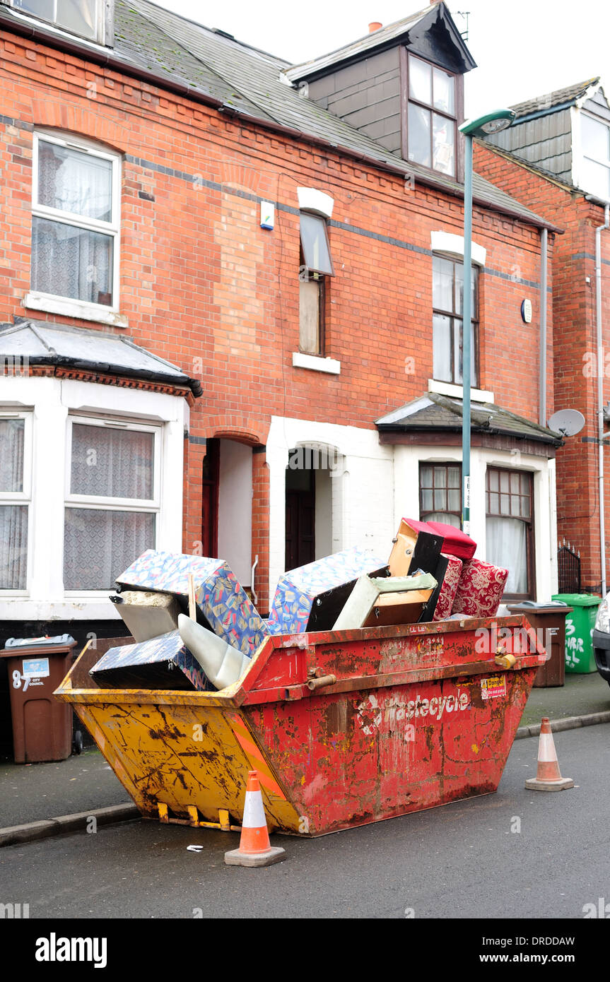 Builders Skip Outside Terraced Housing,UK Stock Photo - Alamy
