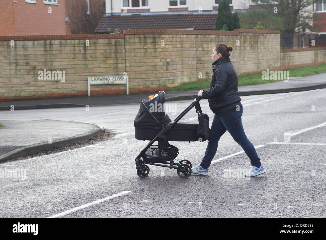 Pushing baby buggie hi-res stock photography and images - Alamy