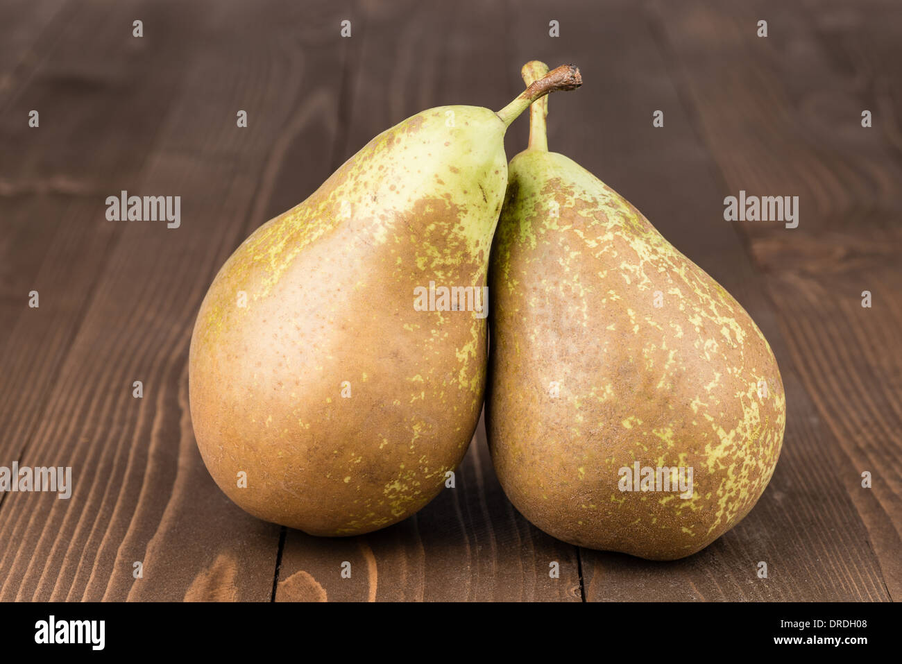 Pears on a rustic wooden table Stock Photo - Alamy