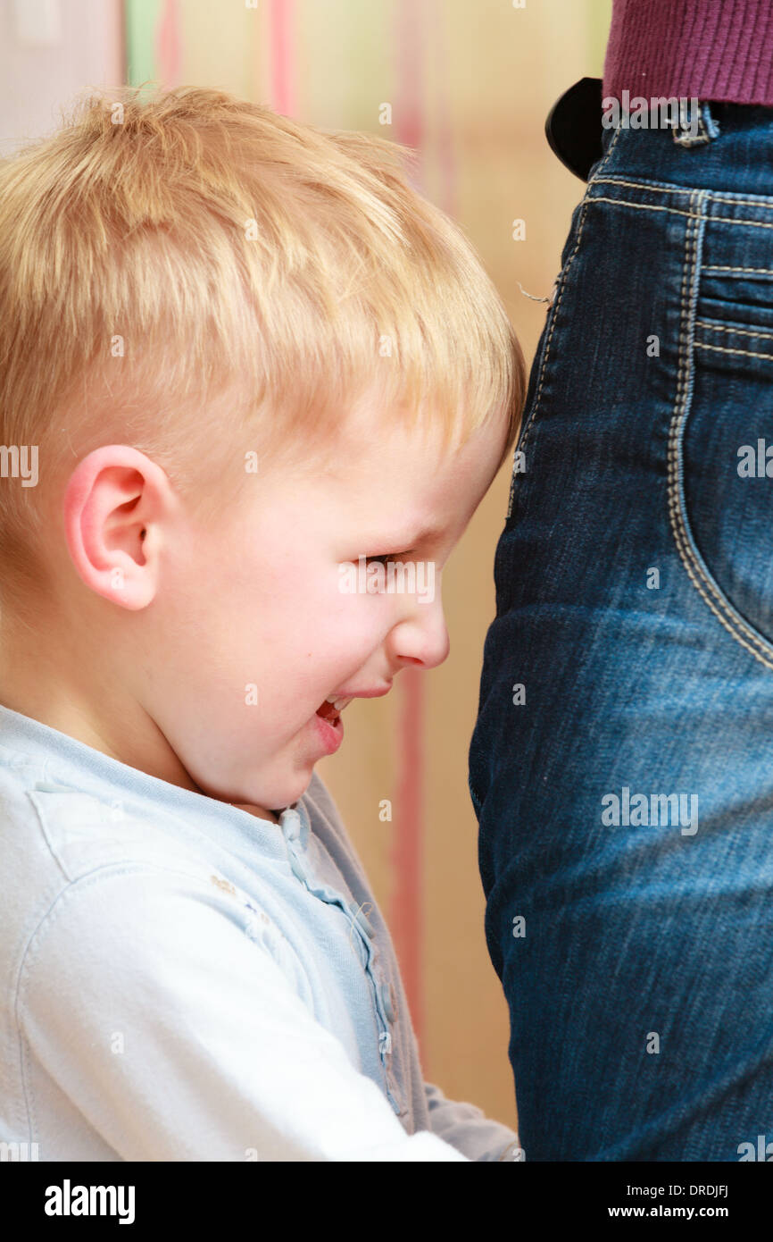 Childhood and motherhood. Unhappy angry boy kid son and his mother ...