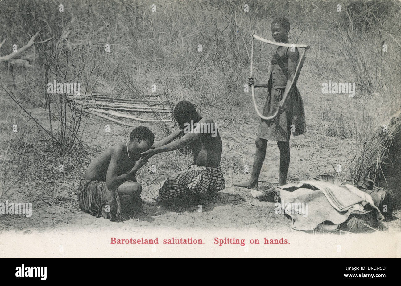 Zambia - Spitting on Hands Greeting Stock Photo - Alamy