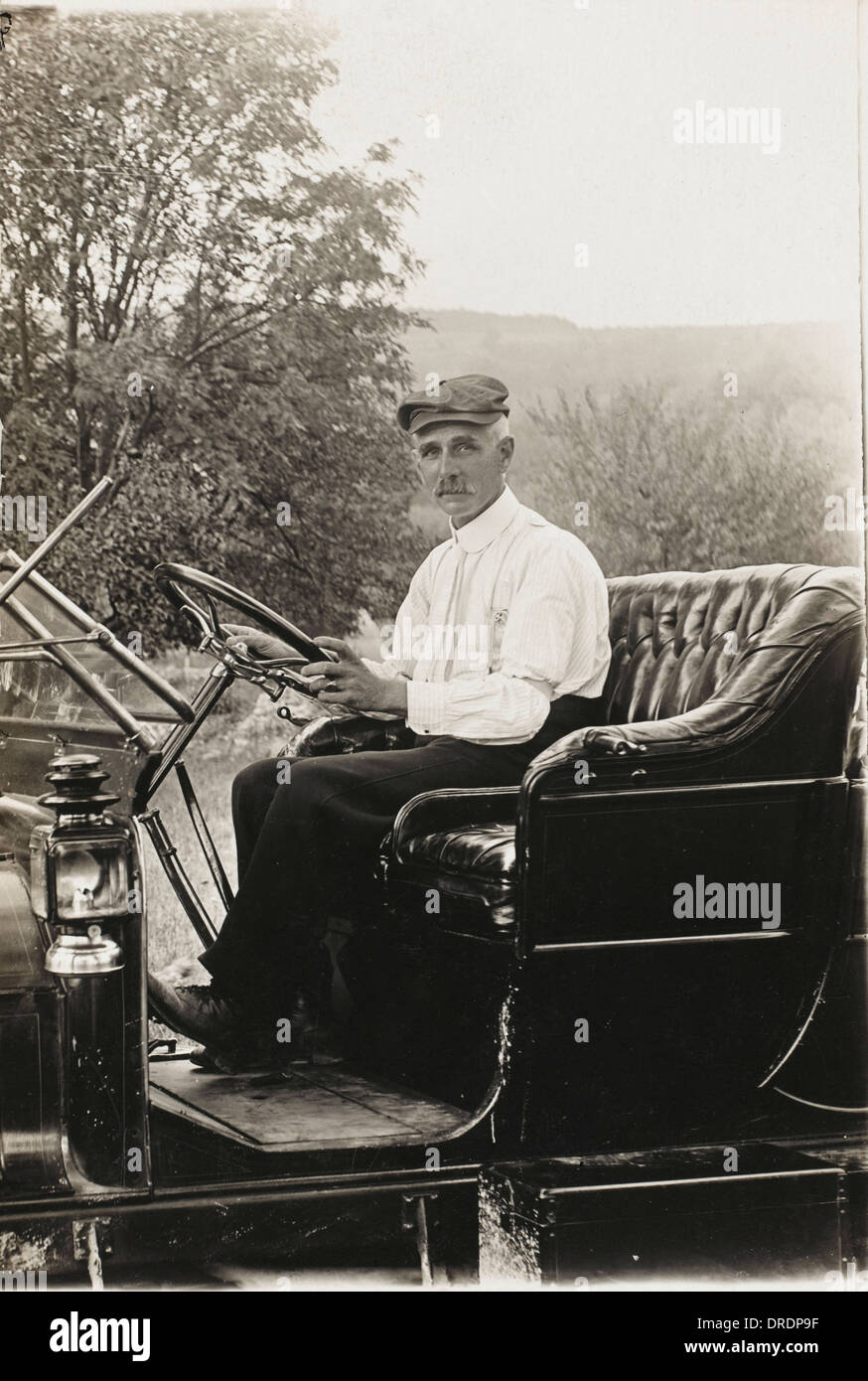 Man driving vintage car Stock Photo - Alamy