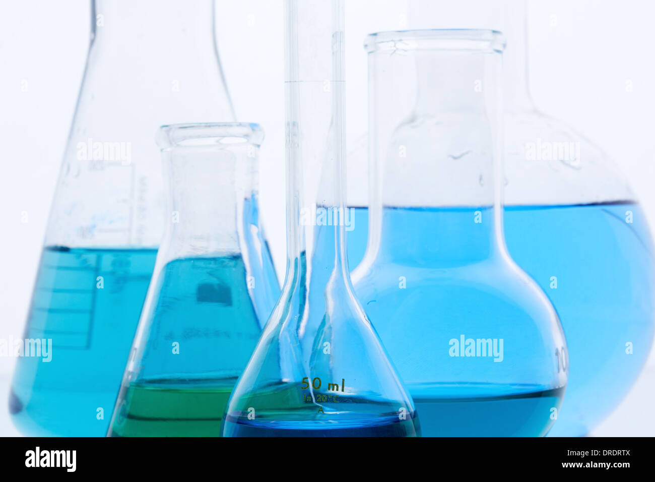 Image of several flasks with blue liquid in laboratory Stock Photo - Alamy