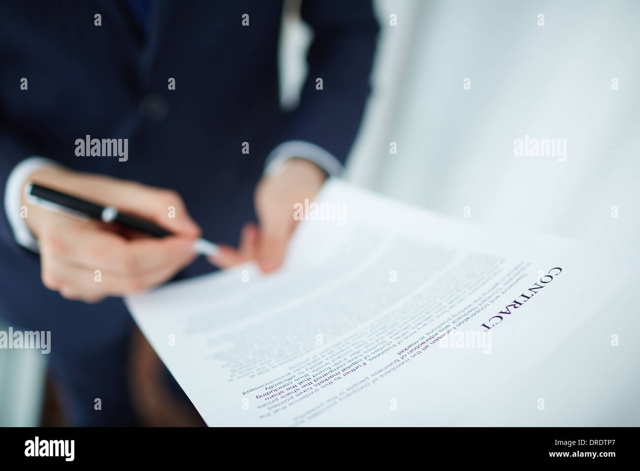 Image of contract being read and signed by businessman Stock Photo - Alamy
