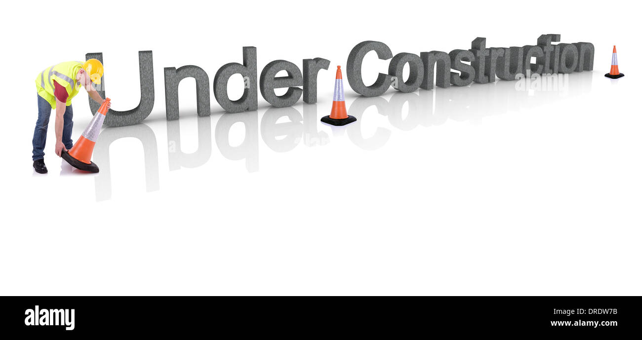 worker setting out cones around text of under construction Stock Photo ...