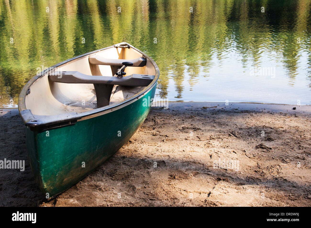 Canoe on the beach Stock Photo - Alamy