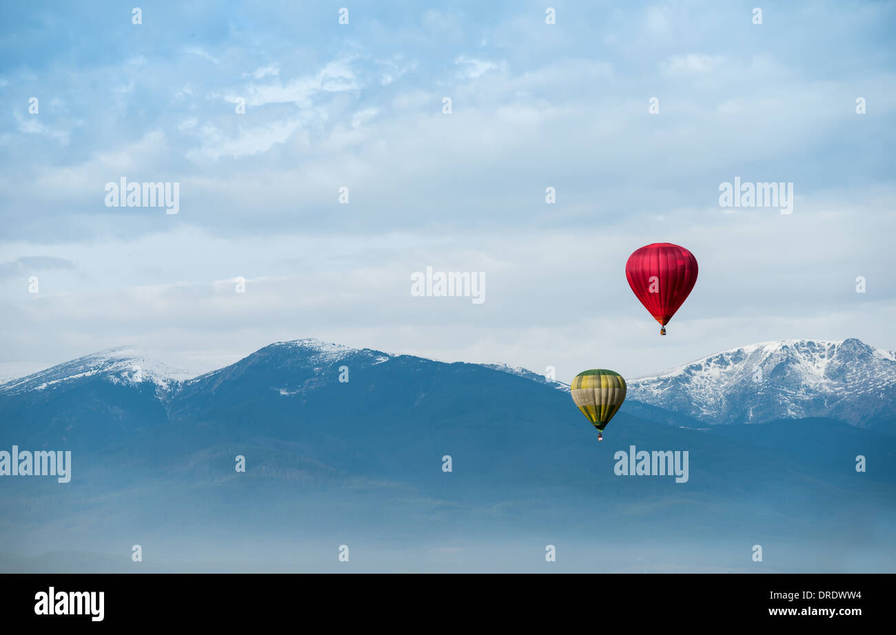 Red balloon in the blue cloudy sky Stock Photo - Alamy