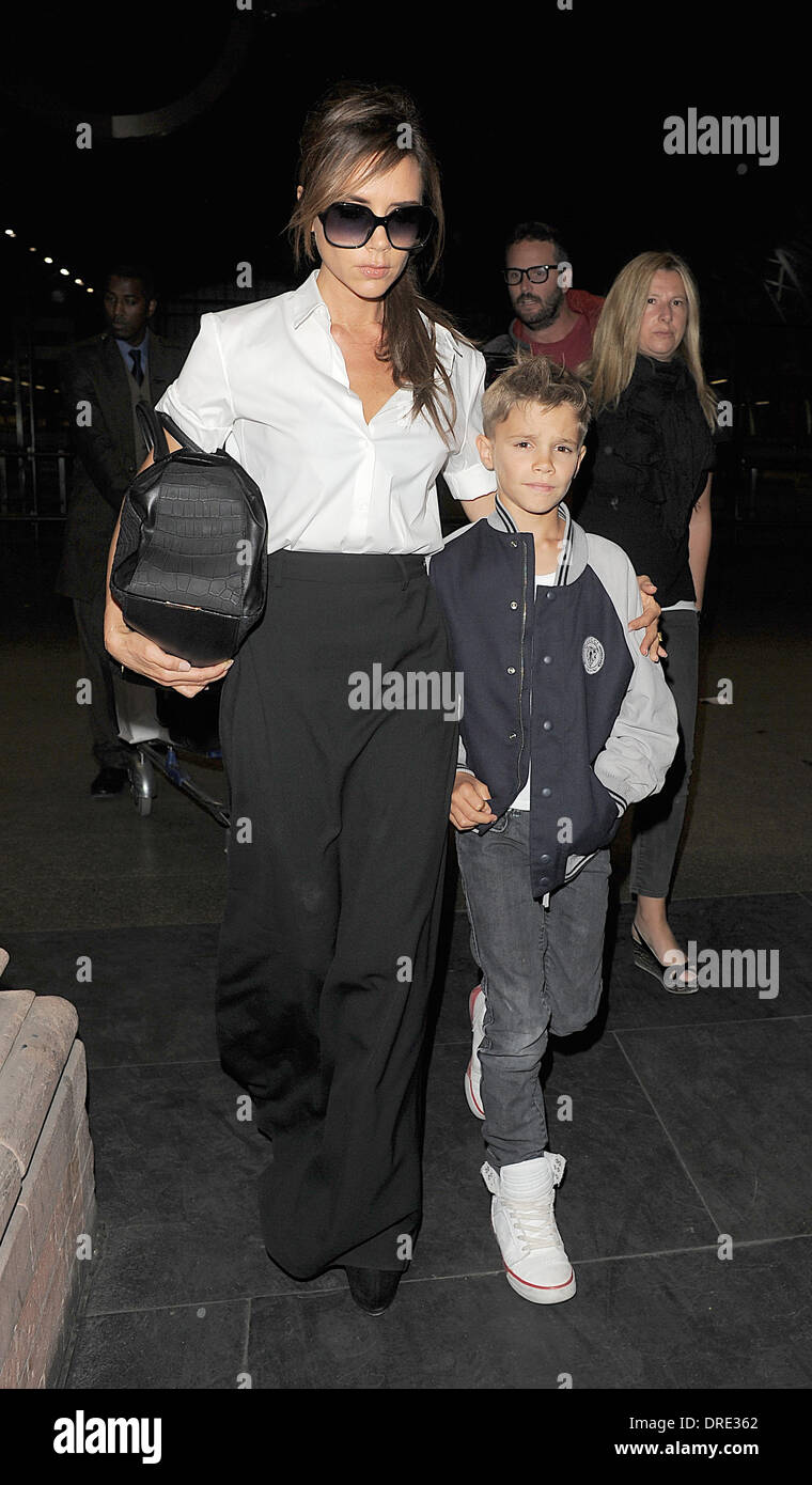 Victoria Beckham and Romeo Beckham arrive at Kings Cross St. Pancras ...
