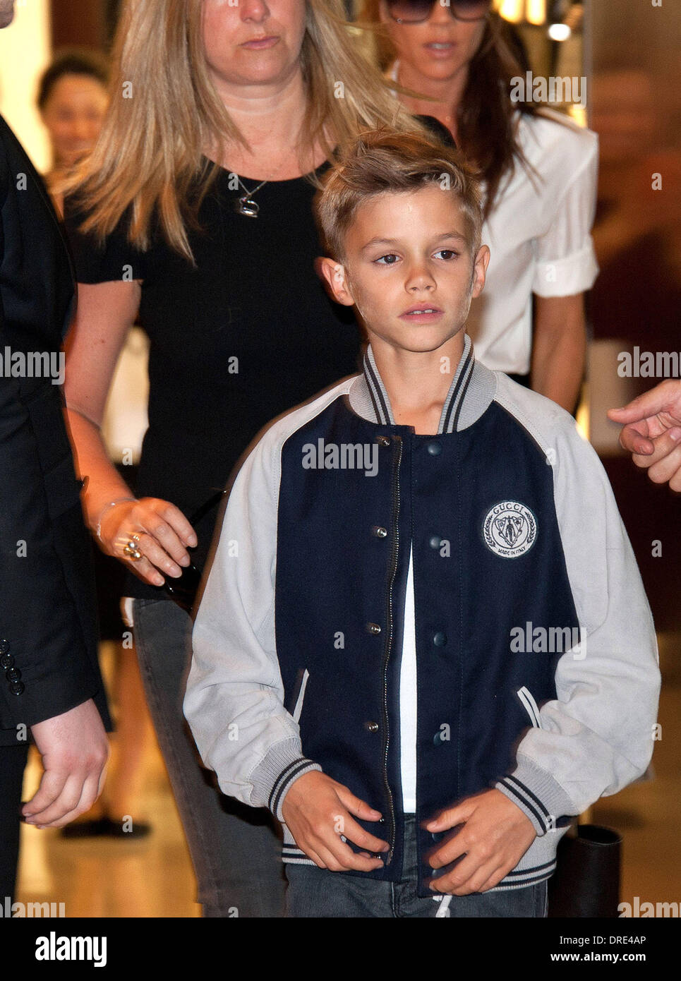 Victoria Beckham and her son Romeo Beckham leaving the Chanel store in ...