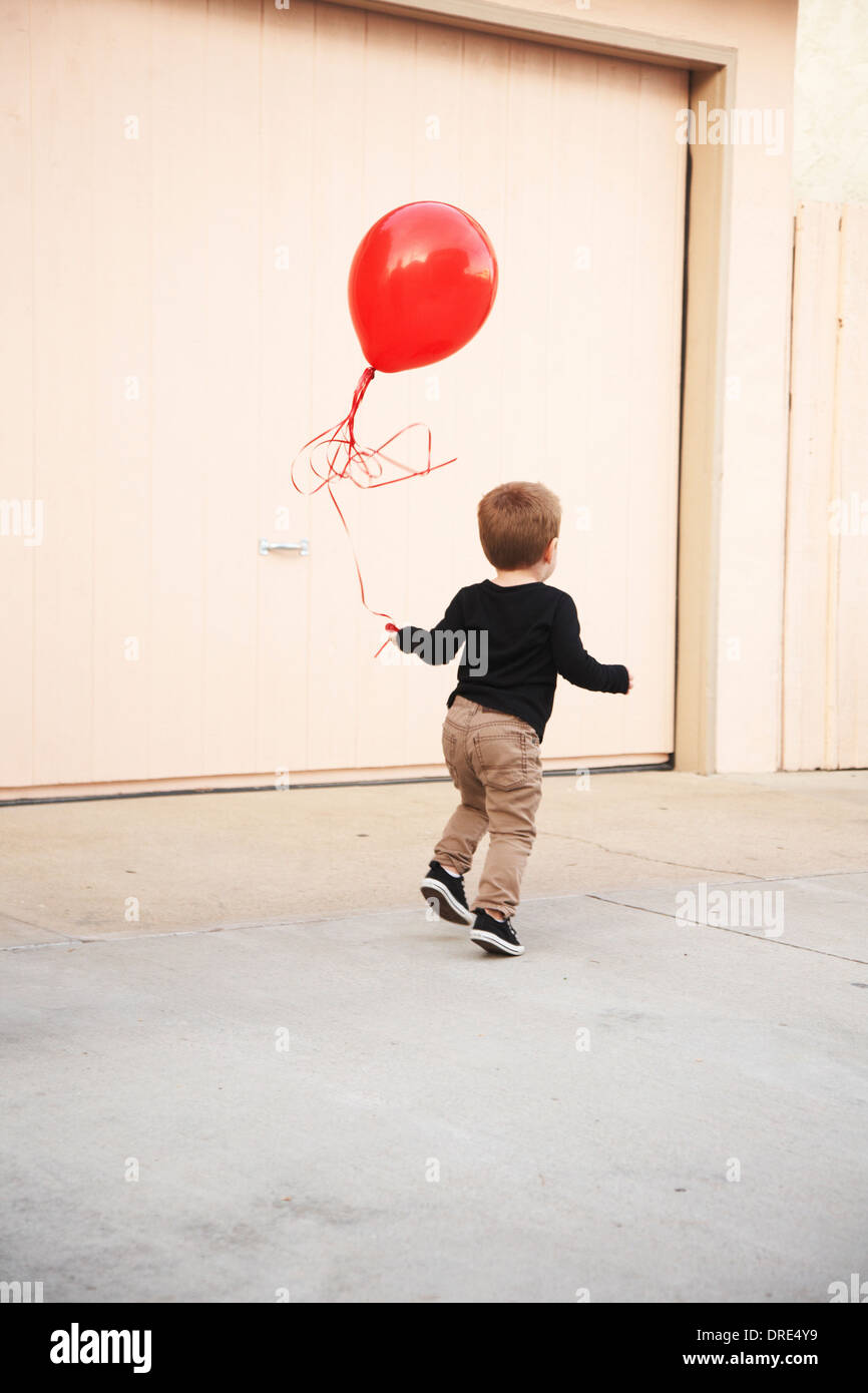 Boy with a balloon hi-res stock photography and images - Alamy