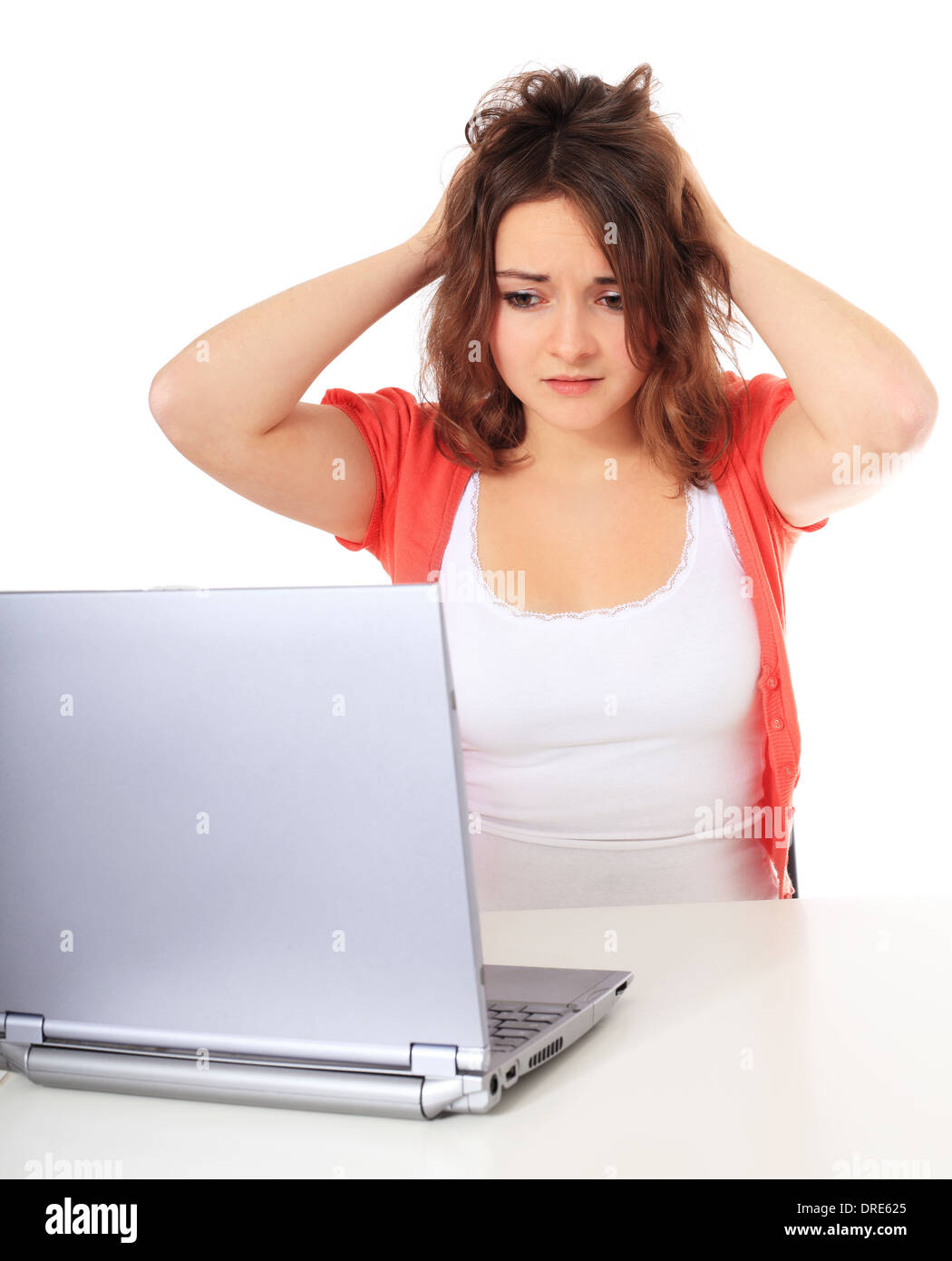 Frustrated student sitting in front of her laptop. All on white ...