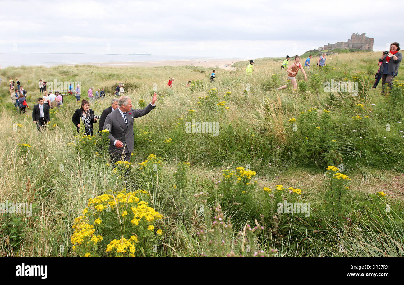 Prince Charles, Prince of Wales is seen walking on the beach with the ...