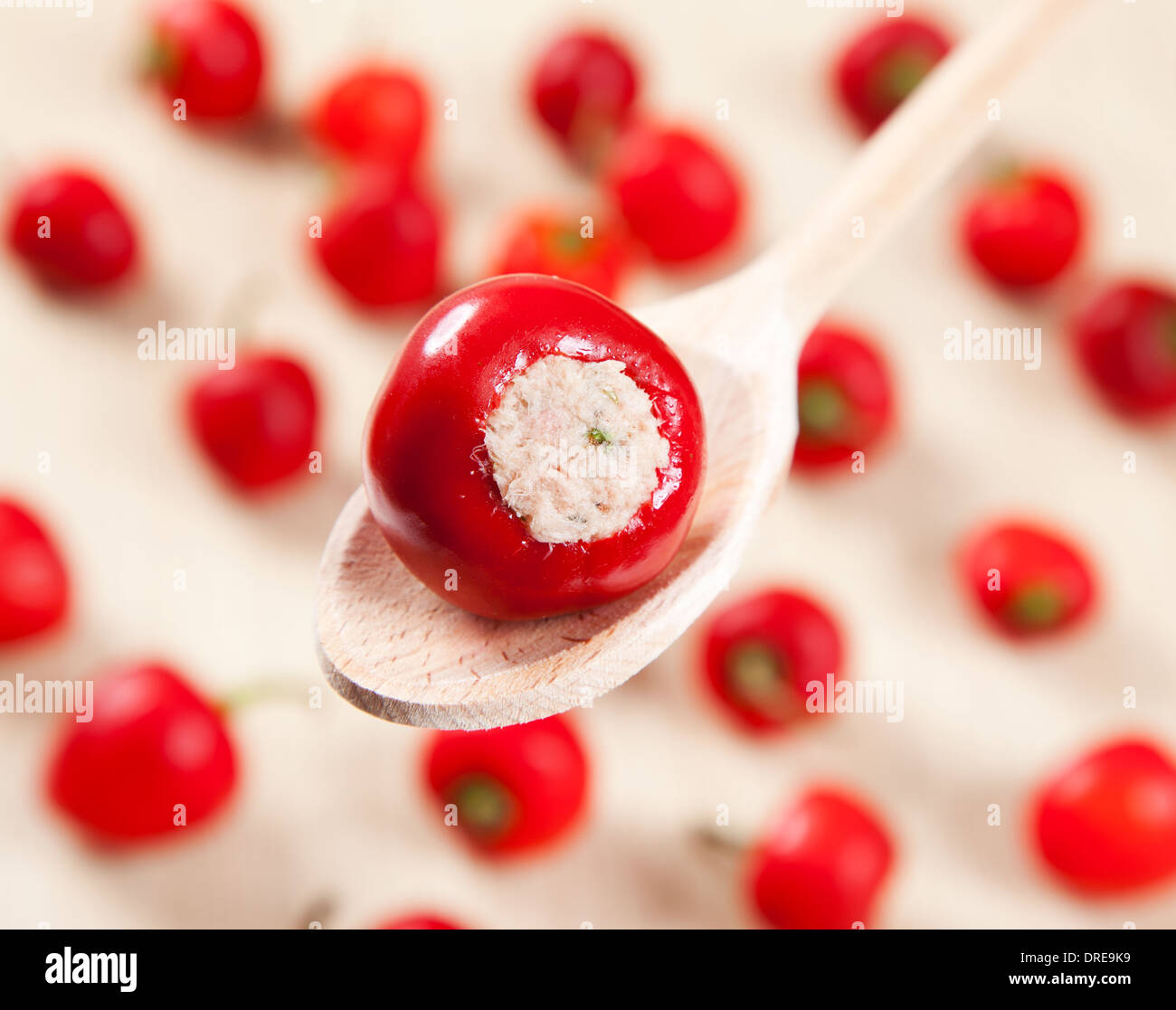 red stuffing pepper in a wooden spoon Stock Photo - Alamy