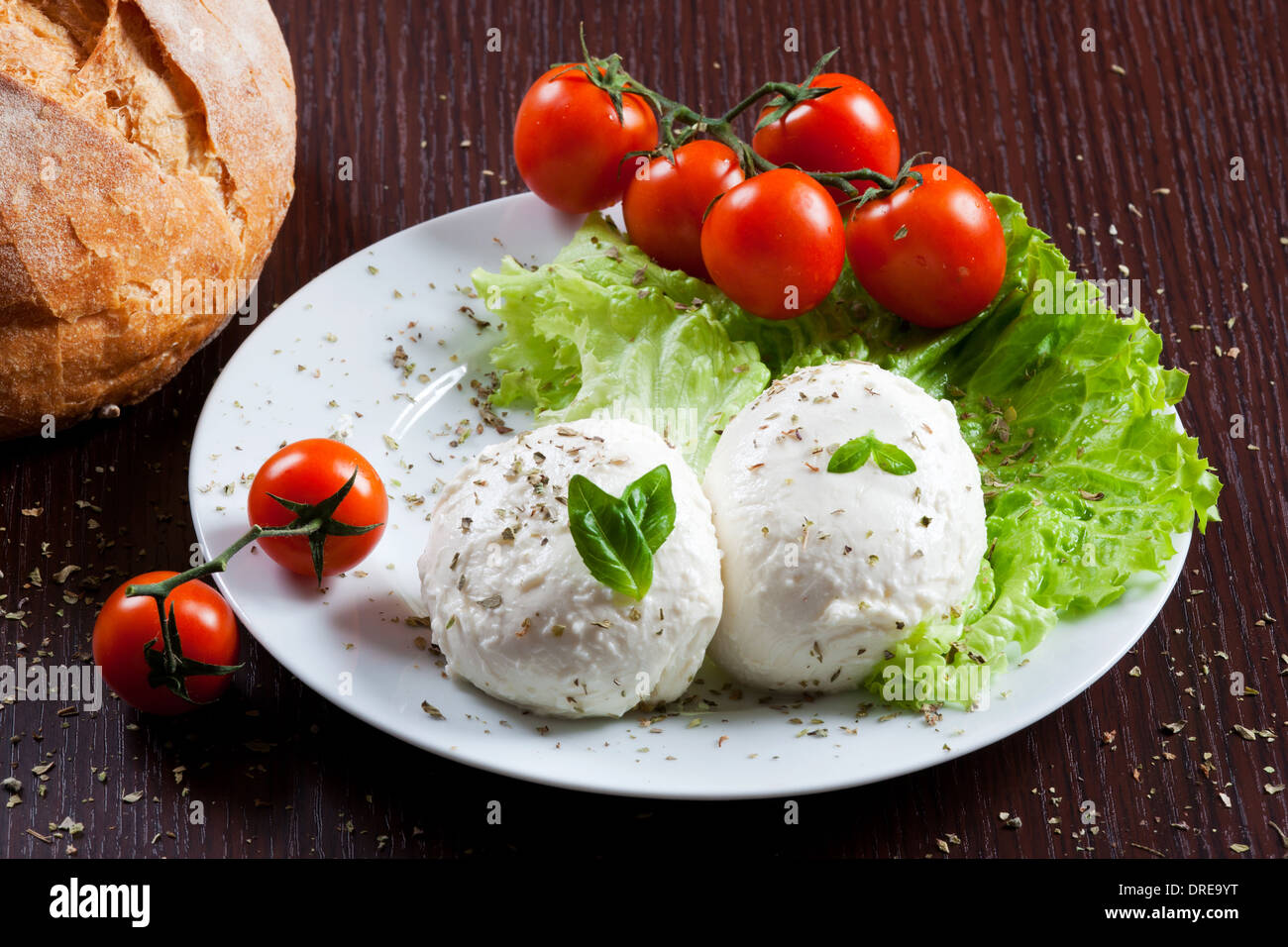 Fresh italian mozzarella with vegetables and tomatoes Stock Photo - Alamy