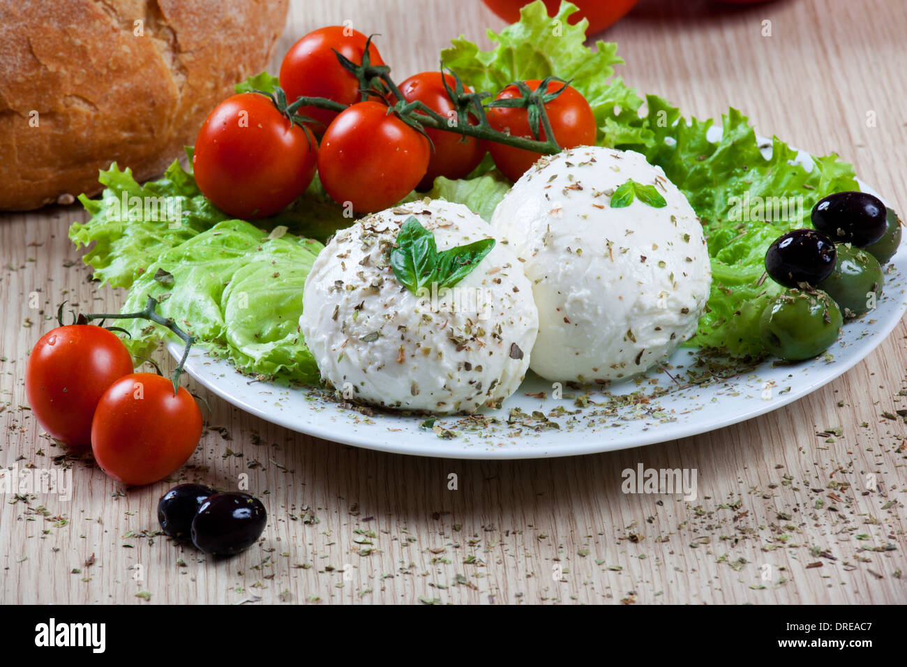 Fresh italian mozzarella with vegetables and tomatoes Stock Photo - Alamy