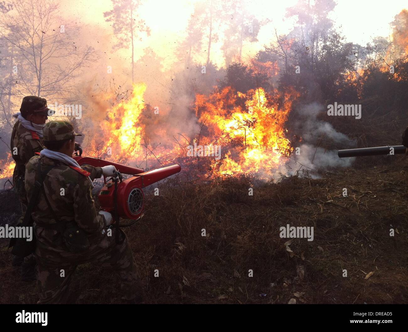 Fuquan, China's Guizhou Province. 24th Jan, 2014. Rescuers put out a ...