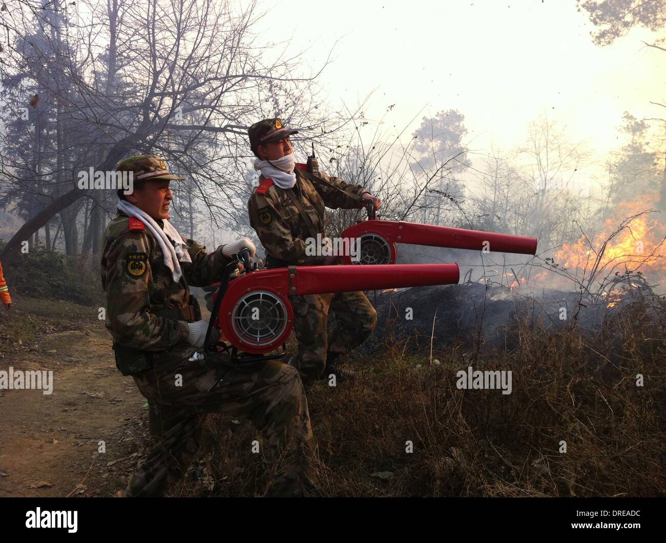 Fuquan, China's Guizhou Province. 24th Jan, 2014. Rescuers put out a ...