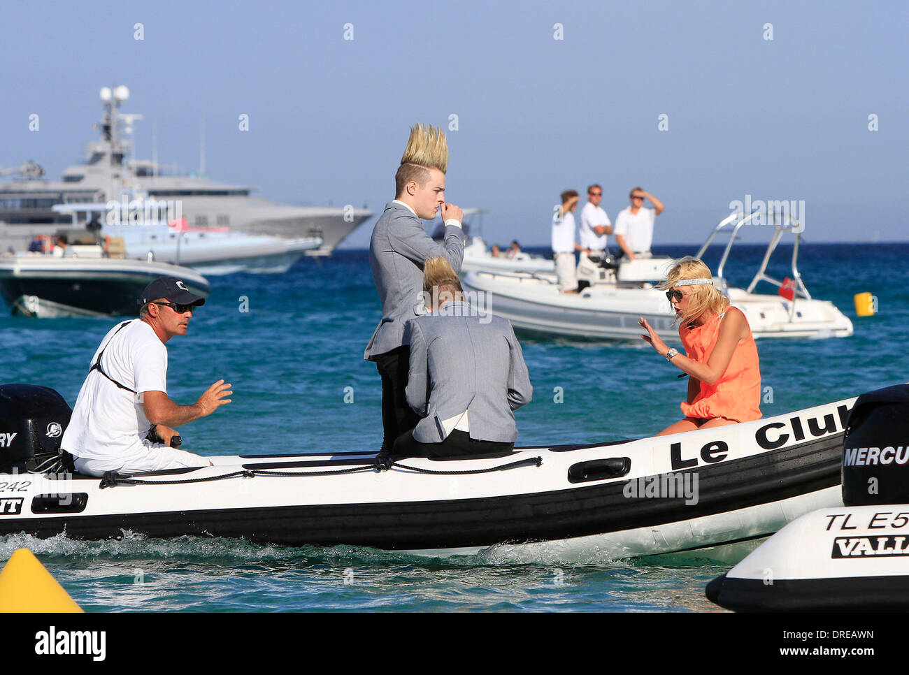 Tara Reid with the Jedward twins John and Edward Grimes boarding a boat ...