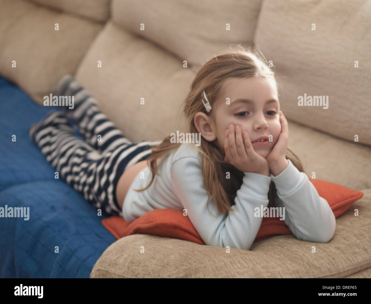 five years old girl rest in a sofa at a suburban house Stock Photo - Alamy