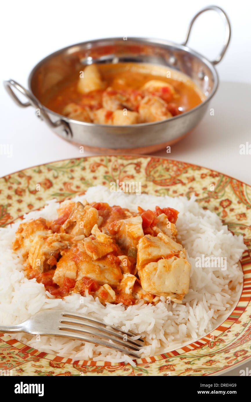 Basic fish curry, in a spicy tomato and coconut milk sauce, on a bed of ...