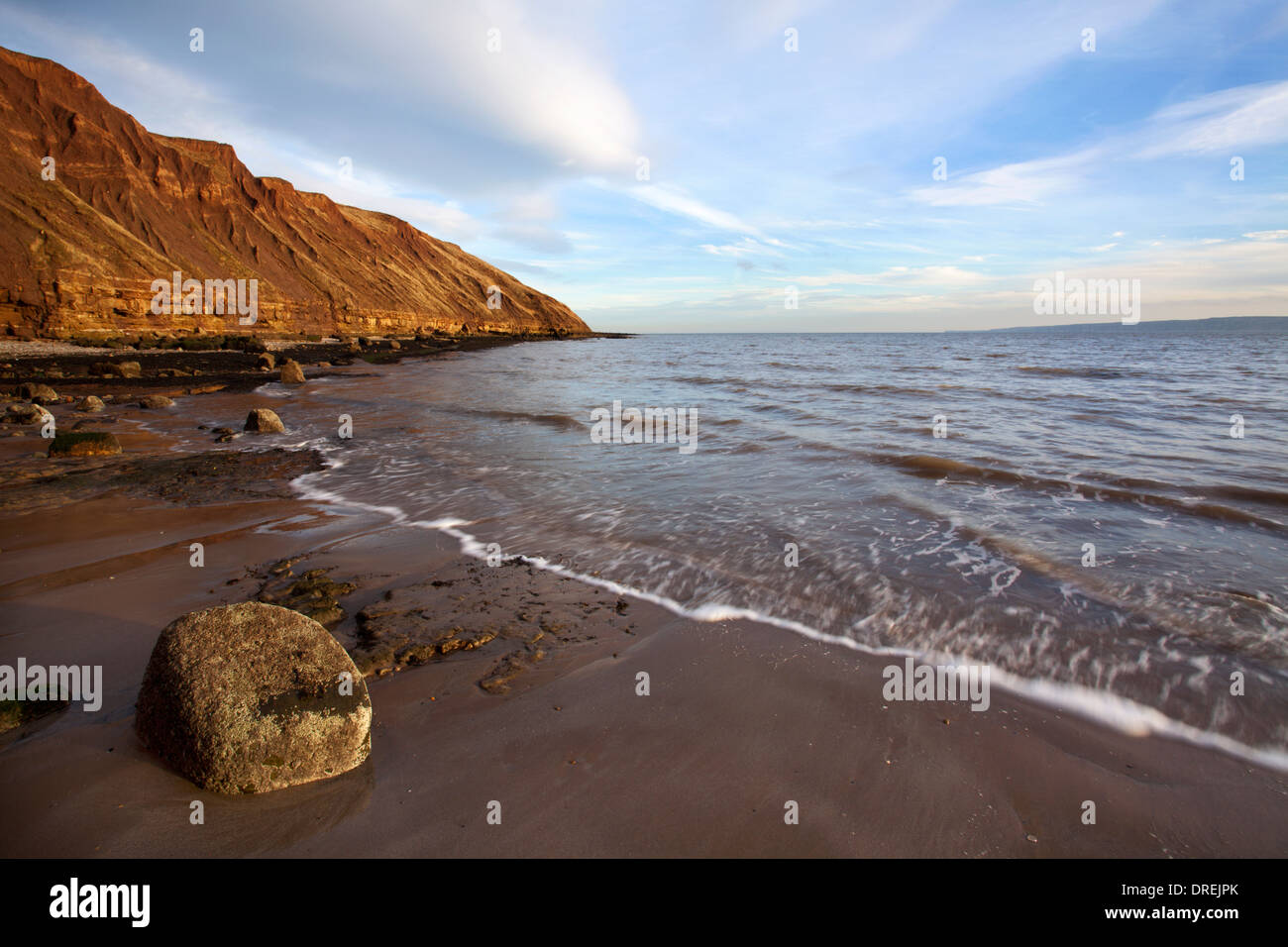 Rock on the Beach and Filey Brigg Filey North Yorkshire England Stock ...