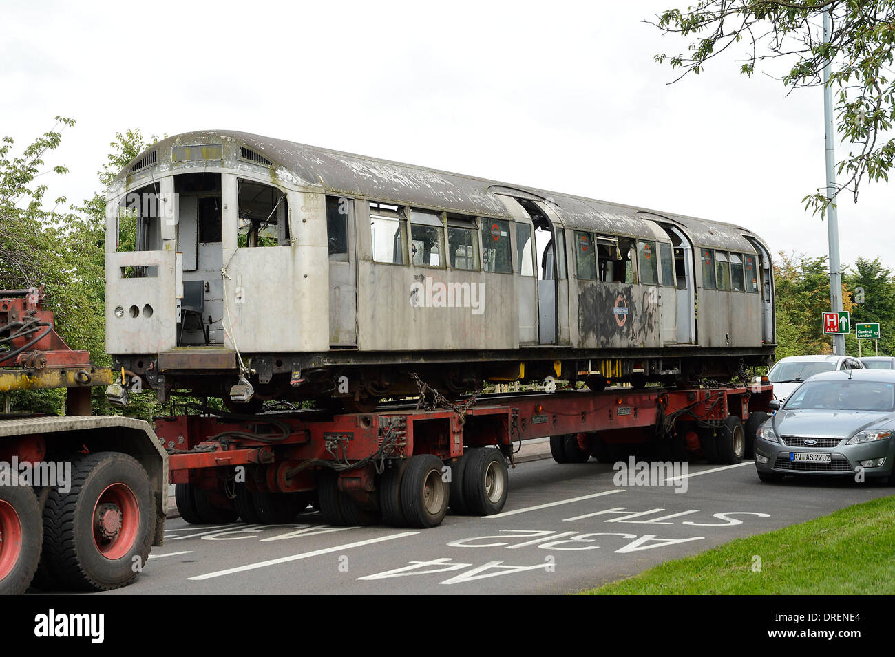 A carriage section of an old tube train being transported through ...