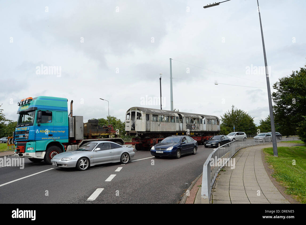 A carriage section of an old tube train being transported through ...