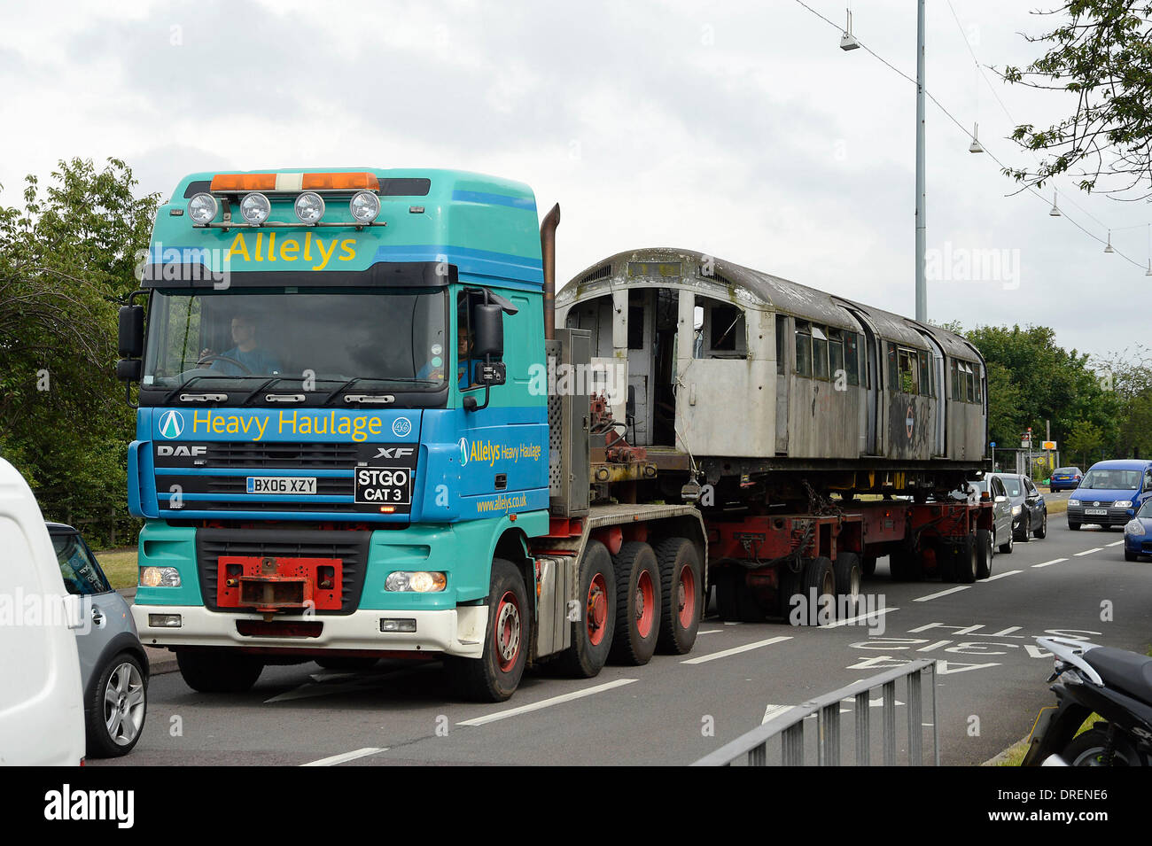 A carriage section of an old tube train being transported through ...