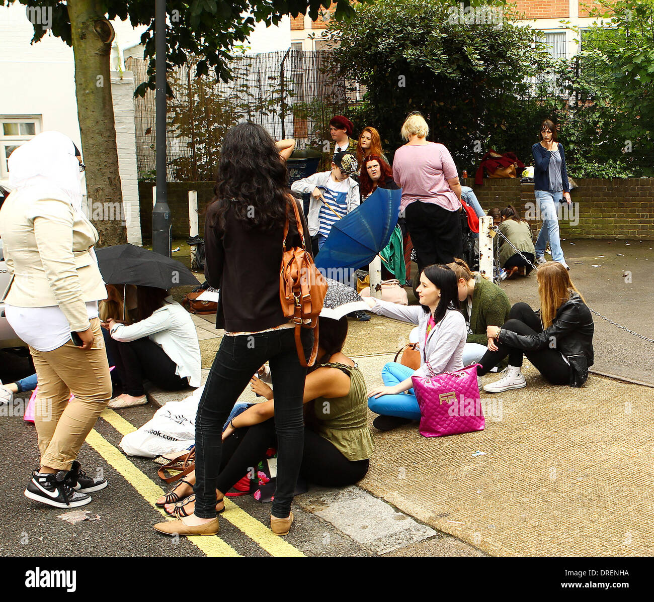 Atmosphere - Fans waiting outside 'One Direction' arriving at a ...
