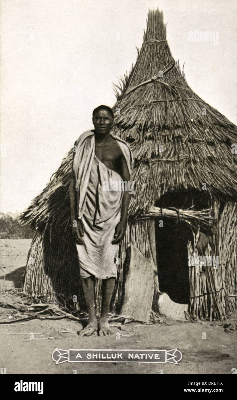 Sudan - A Shilluk man outside his house Stock Photo - Alamy