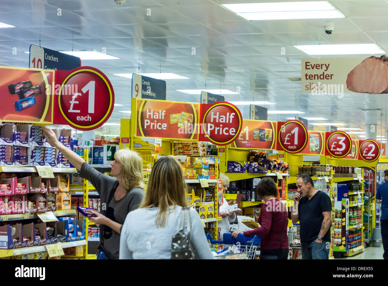Shoppers and offer signs at Tesco Supermarket, UK Stock Photo - Alamy