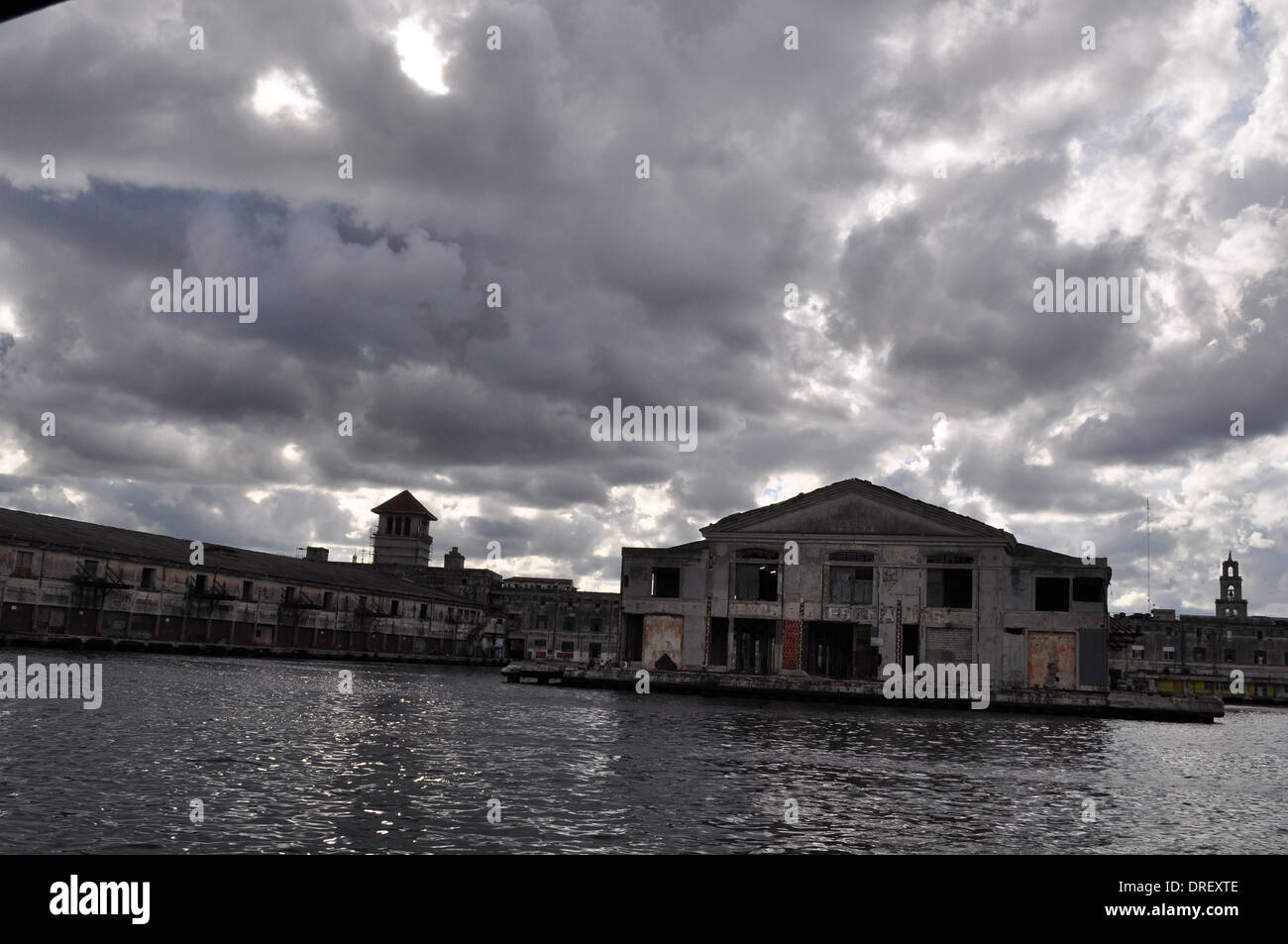 Havana, Cuba: late afternoon sky over some of the old port buildings in ...