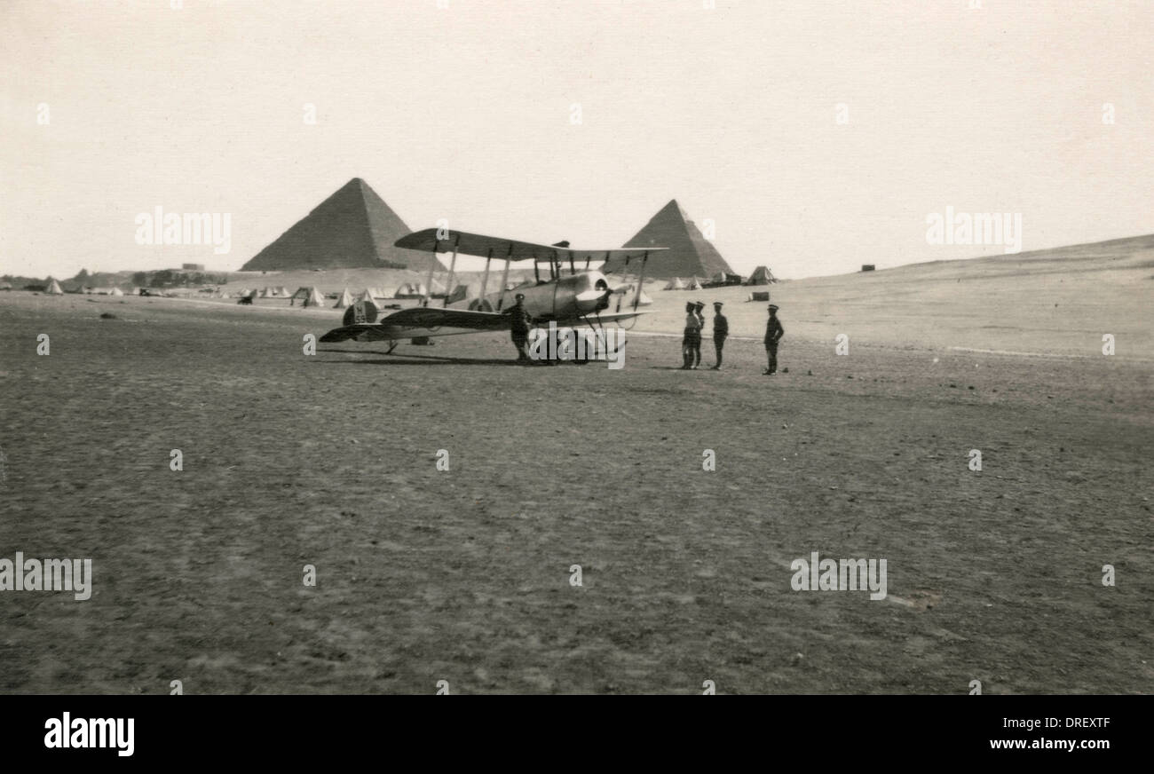 A biplane in the Egyptian desert, with the pyramids Stock Photo - Alamy