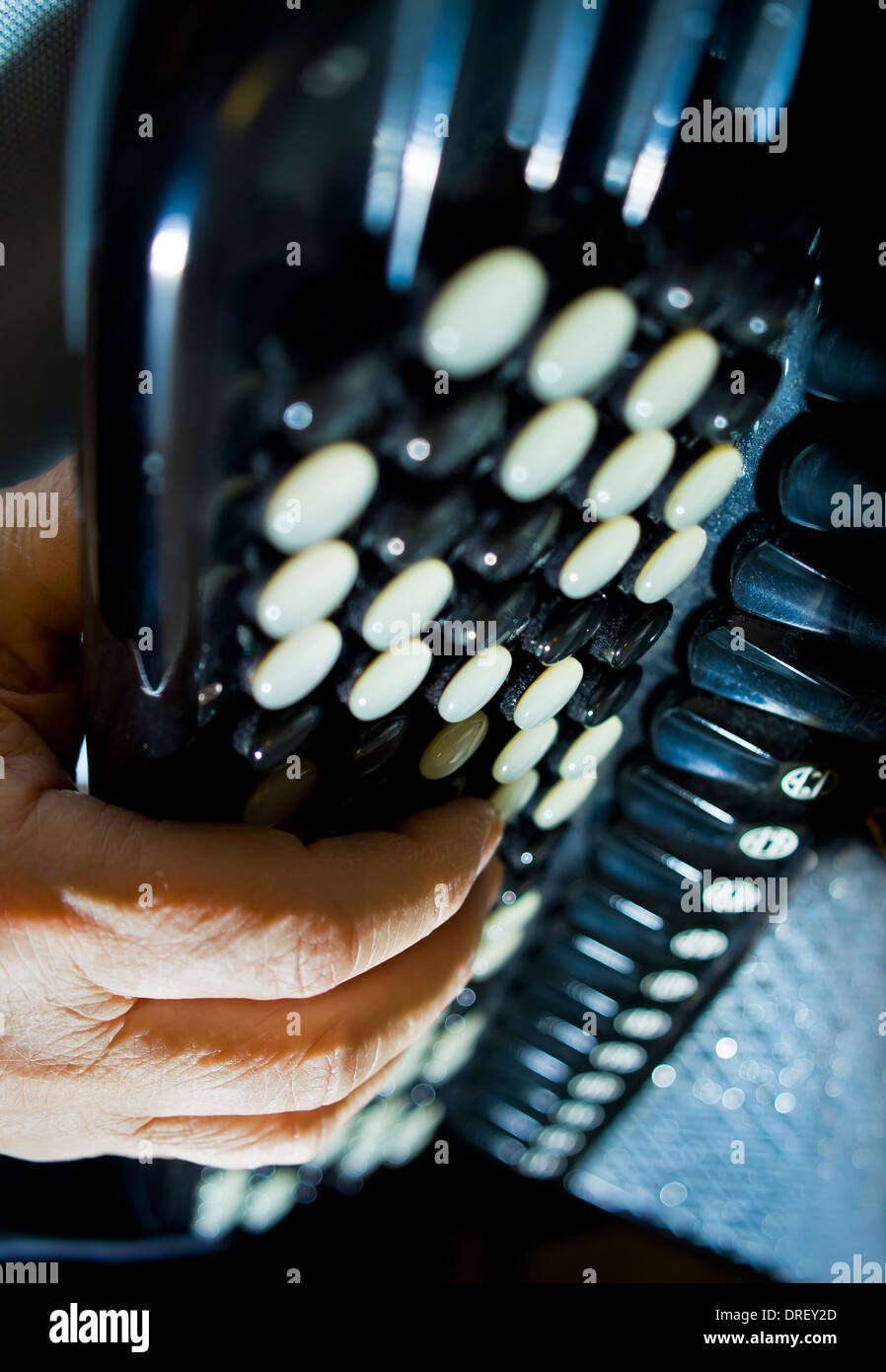 man hand playing on harmonica Stock Photo - Alamy