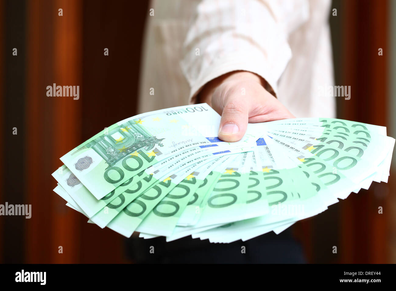 Euro money bills in hands Stock Photo - Alamy