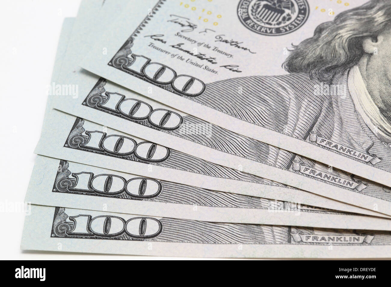 100 dollar bills isolated on white background closeup Stock Photo - Alamy