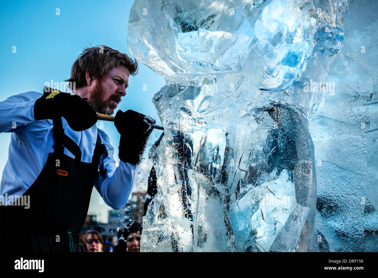 A member of the Irish team working and creating an ice sculpture as ...