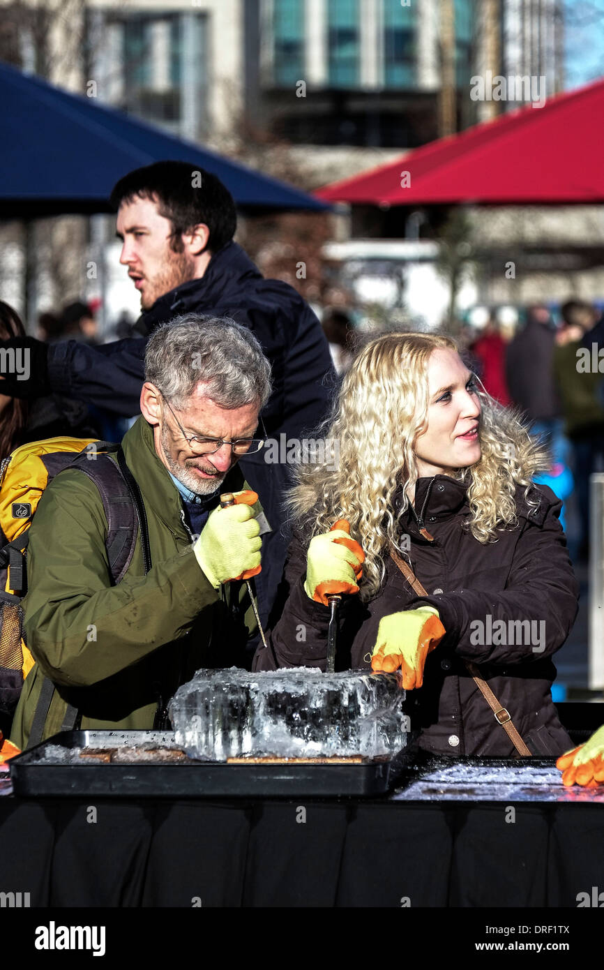 Members of the public trying out ice sculpting as part of the London ...