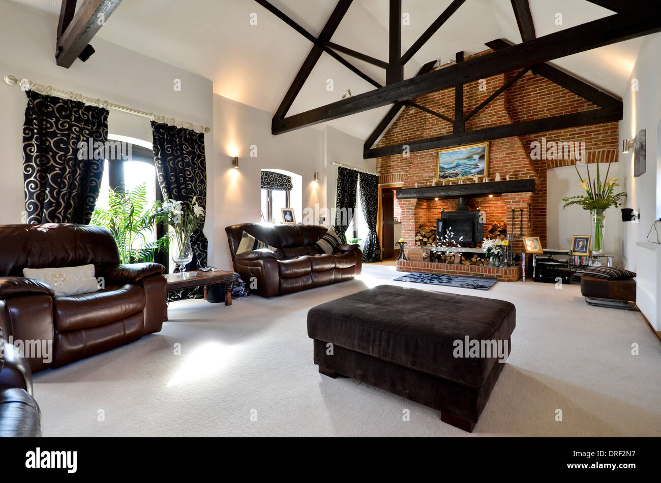 large new build barn conversion lounge with feature fireplace Stock ...