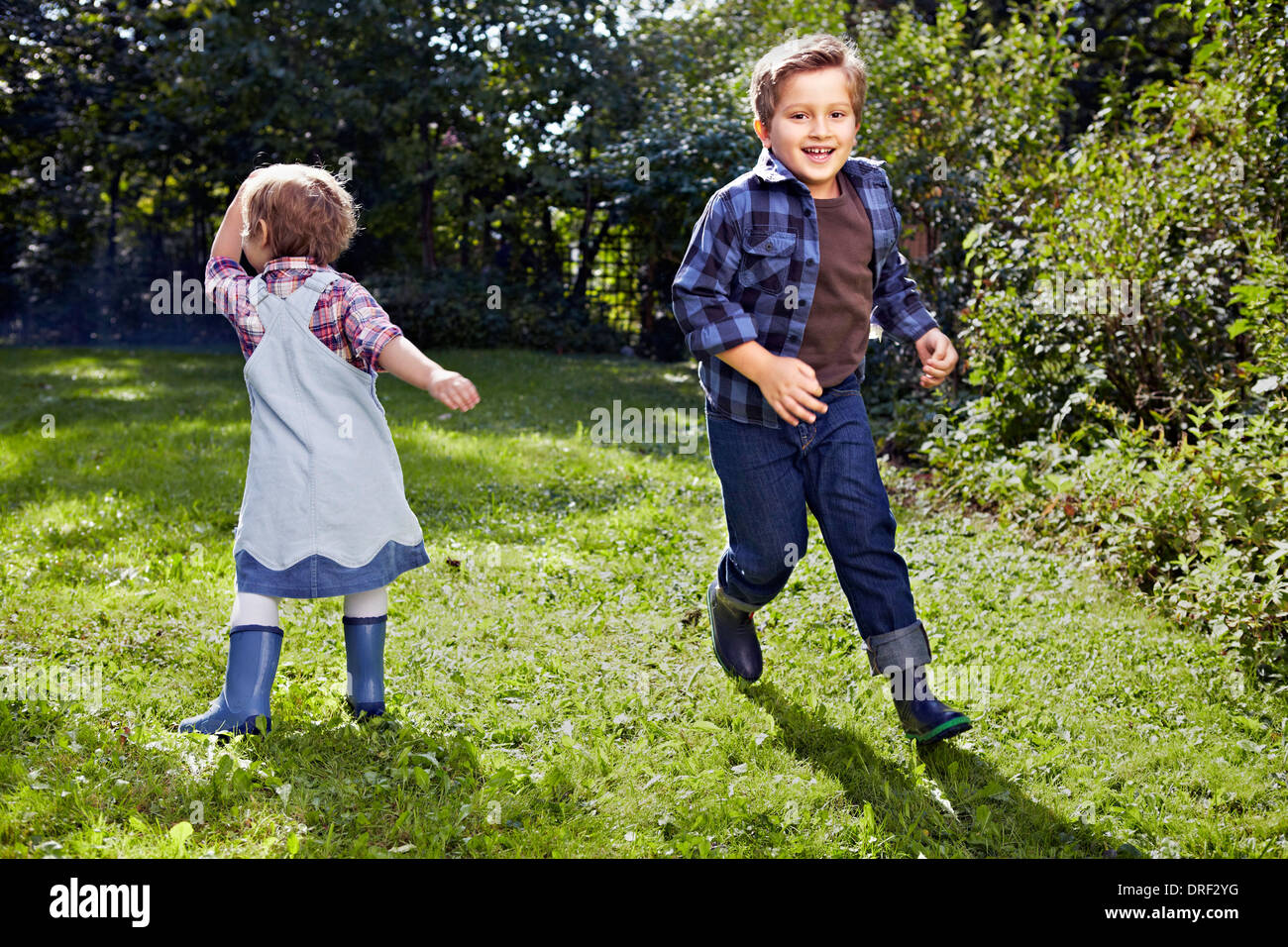 Two Children Running Around, Munich, Bavaria, Germany Stock Photo - Alamy