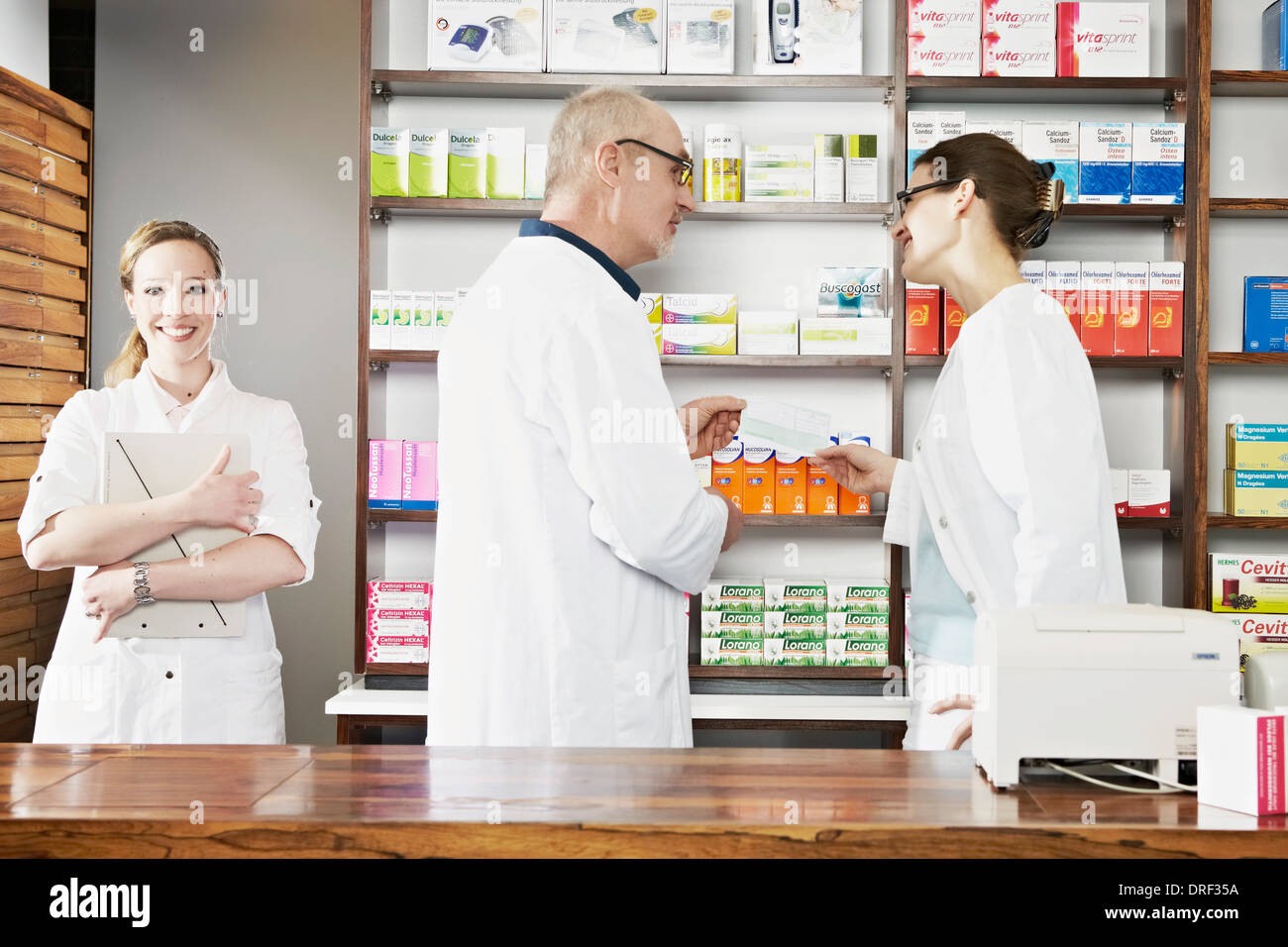 Female Pharmacist Talking To Employee, Munich, Bavaria, Germany Stock ...