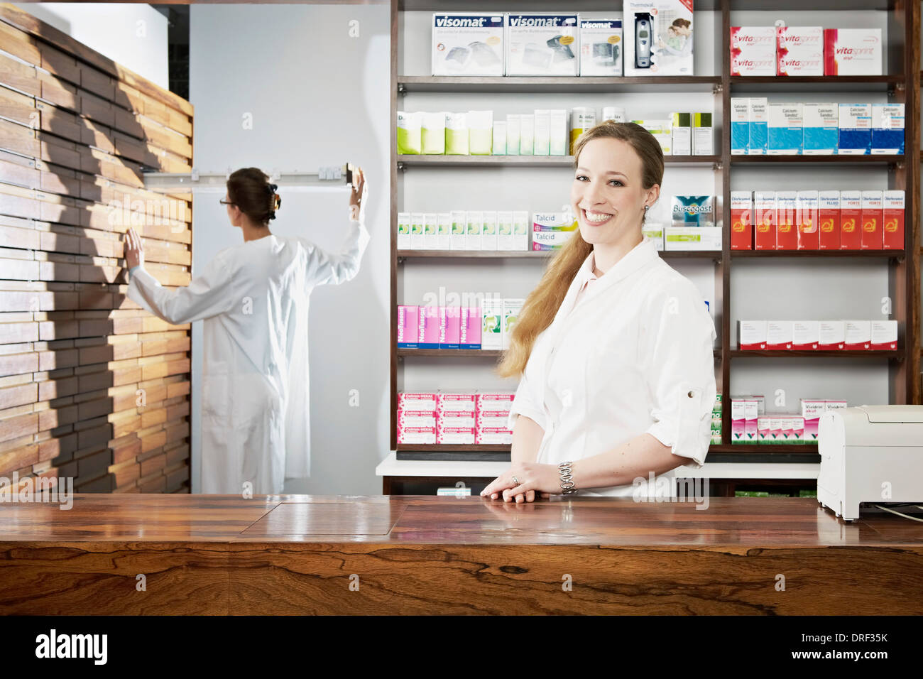 Female pharmacist work place hi-res stock photography and images - Alamy