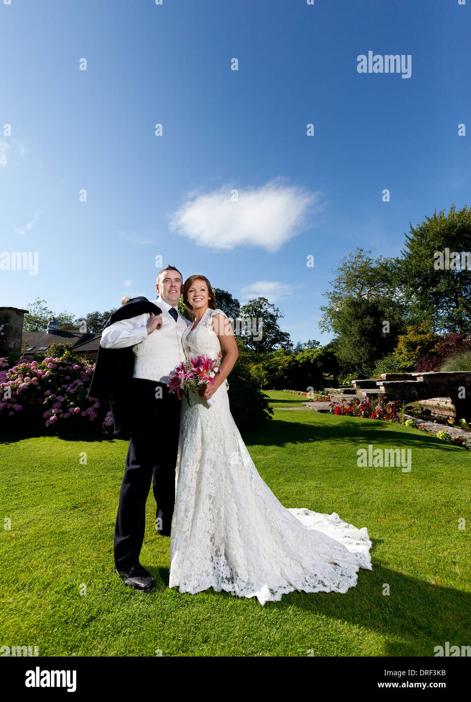couple poses after the ceremony Stock Photo - Alamy