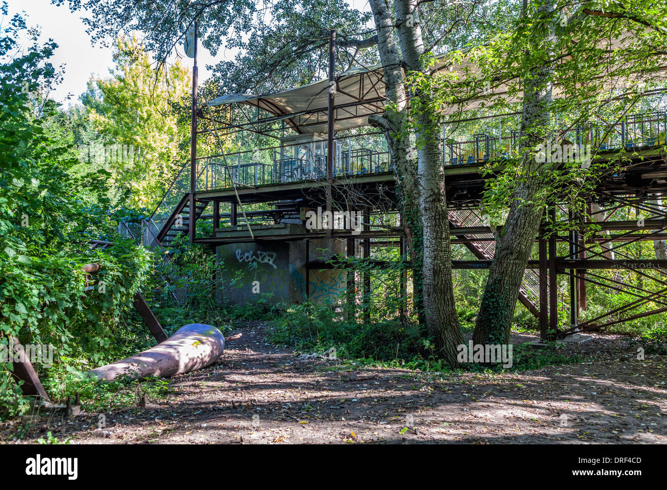 Rusty, broken rollercoaster platform at derelict, abandoned, disused ...